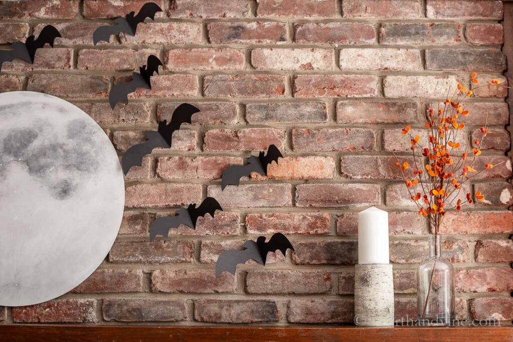 DIY Halloween Bat Decorations Flying Around a Full Moon